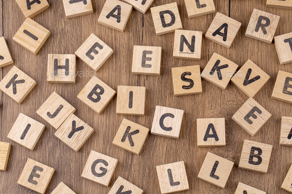 Alphabets on wooden cubes as a background Stock Photo by esindeniz