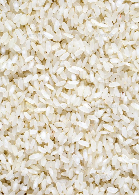 Top view of a heap of raw parboiled rice isolated on white background ...