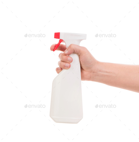 Hand holding white plastic spray bottle. Stock Photo by indigolotos