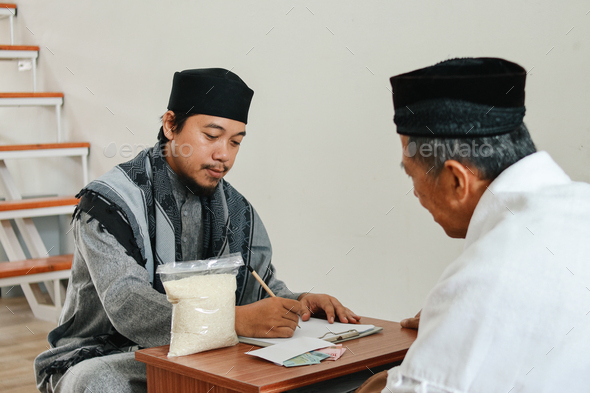 Muslim Man Writing Zakat List Stock Photo by Queenmoonlite35 | PhotoDune