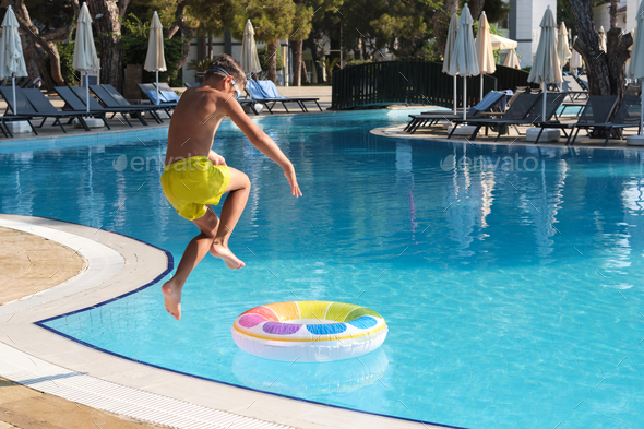 Modern day carpe diem: Youthful exuberance captured in a leap into cool ...