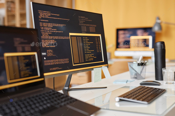 Close Up Computer Screen with Code Lines on Desk in IT Development ...