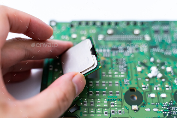 IC CPU in hand with PCB board background. Concept of Technology ...
