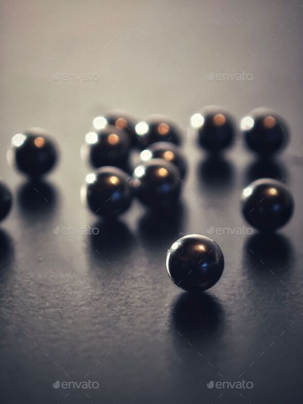 Cluster of spherical objects resting on a flat surface, arranged side by side Stock Photo by ...