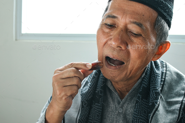 Elderly Muslim Man Eating Dates Fruit Stock Photo by Queenmoonlite35