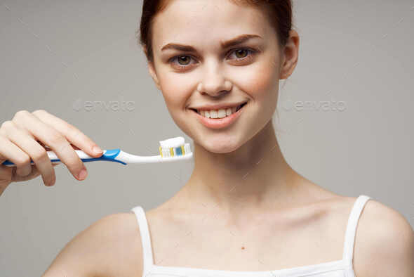 cheerful woman toothpaste brushing teeth dental health studio lifestyle ...