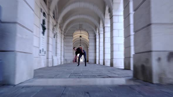 Professional Dancer Performs Ballet Standing Under Arches, Stock Footage