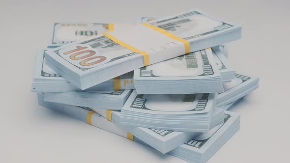stack of bank bundles with dollars rotating on white background, Stock ...