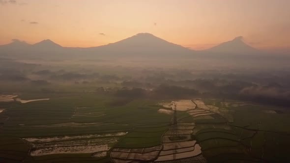 Rice fields and Mount Andong in the background, Magelang, Central Java, Indonesia. Aerial ...
