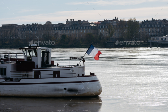 Boat with french flag with in Bordeaux in France. Stock Photo by eudial2224