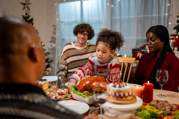 Multi-ethnic big family celebrating Christmas party together in house ...