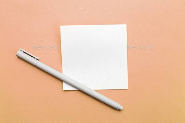 Top view of blank note paper with pen on Peach Fuzz background Stock ...