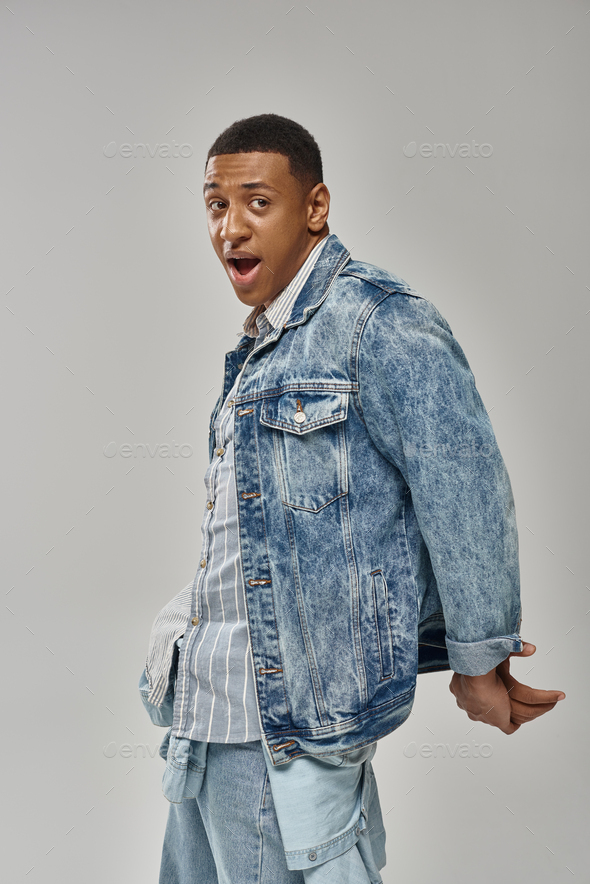 shocked emotional african american man in stylish denim outfit ...