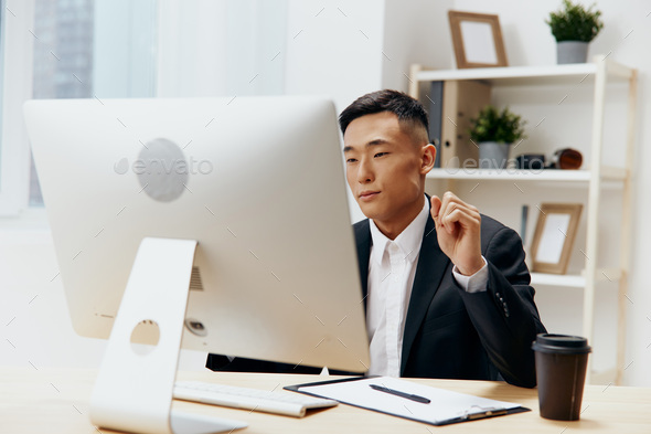 manager sitting at a desk in front of a computer emotions Workspace ...