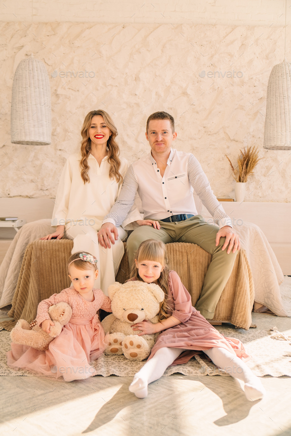 family of four portrait mother father and two sisters Stock Photo by ...