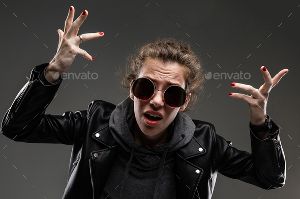 Young girl with rough facial features, patted brown hair, bright ...