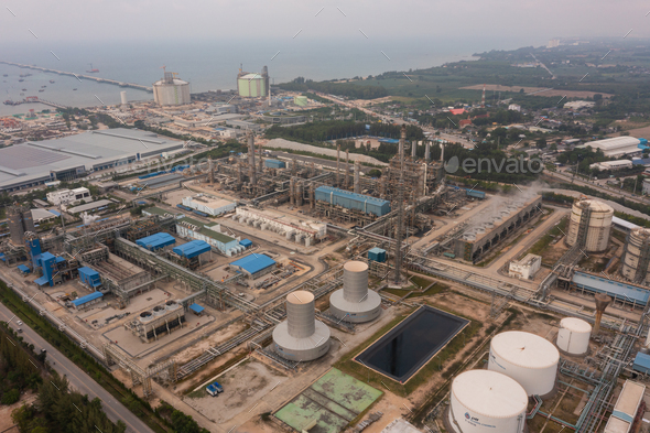 Aerial view of petrochemical oil refinery and sea in industrial ...