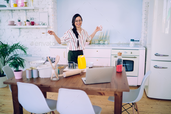 Excited lady smiling during cooking Stock Photo by GaudiLab | PhotoDune