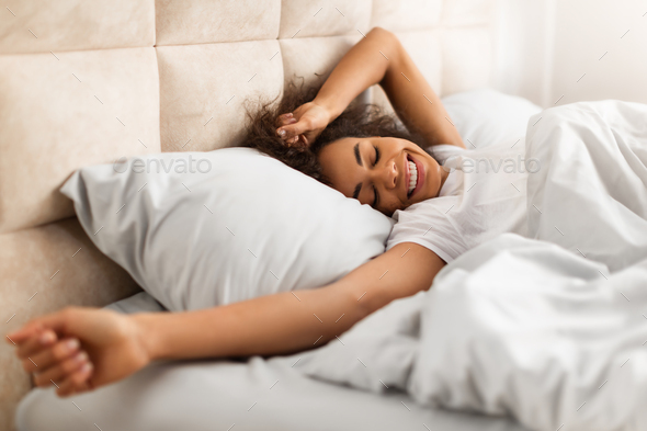 Happy Black Lady Waking Up After Well Sleep In Bedroom Stock Photo by ...