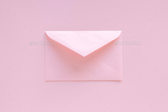 Pink envelope with greeting card on pastel pink background. Letter with ...