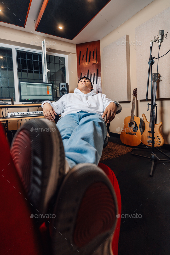 Musician taking a break in a home record music studio Stock Photo by ...