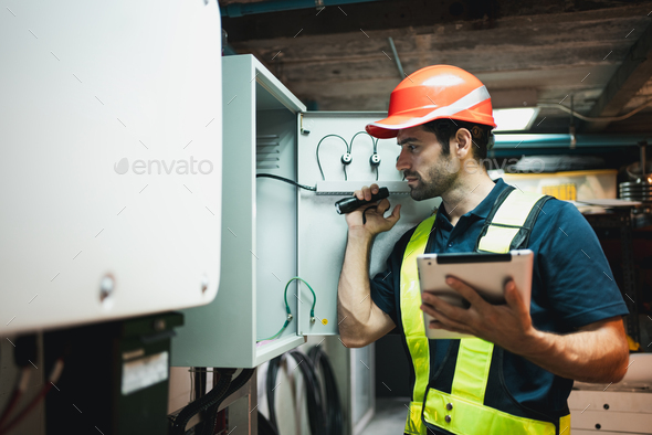 Technician Engineering setting inverter solar panel in electrical room ...