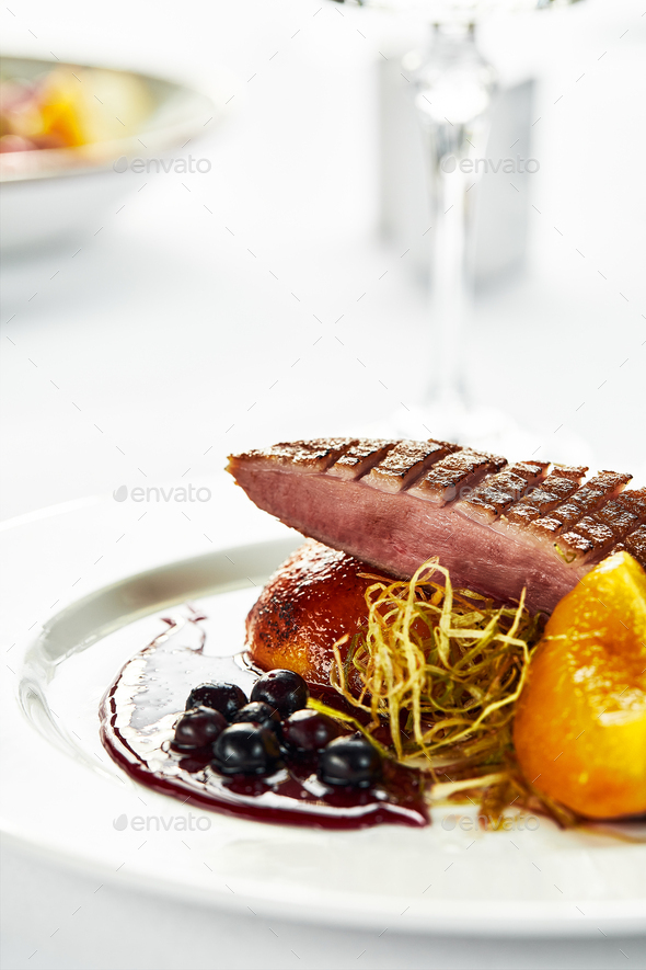 Grilled duck breast with peaches in berry sauce, grilled duck fillet on ...