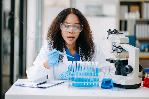 Modern medical research laboratory. female scientist working with micro ...