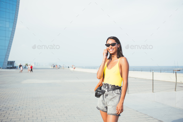 half length portrait of cheerful female phoning via cell app Stock ...