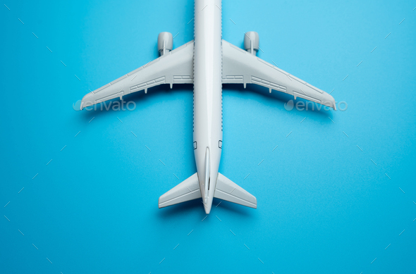 Airline plane top view on blue background. Passenger transportation ...