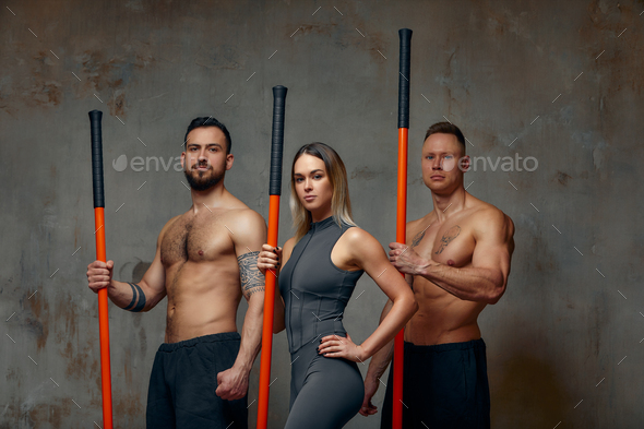 People stand together and practice sticks. Karate masters posing with ...