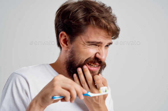 emotional man hygiene toothpaste morning light background Stock Photo ...