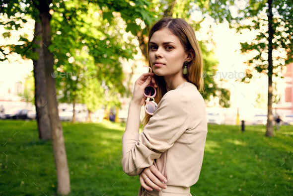 pretty woman walk in the park this summer city trip Stock Photo by ...