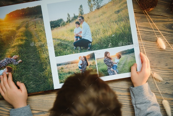 Luxury wooden photo book on natural background. Family memories ...
