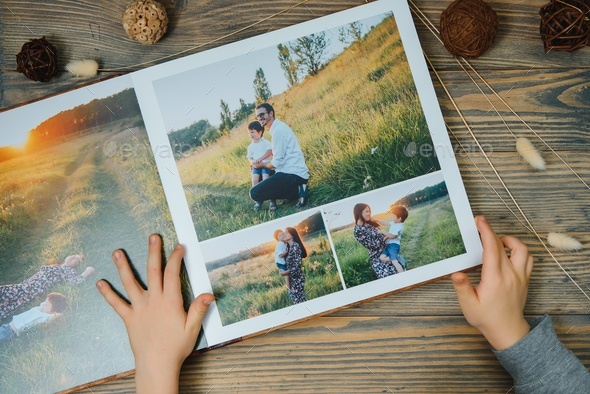 Luxury wooden photo book on natural background. Family memories ...