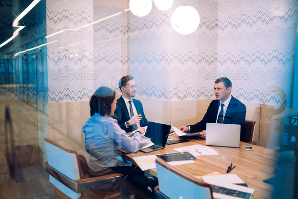 Elegant business people discussing goals and objectives during meeting ...