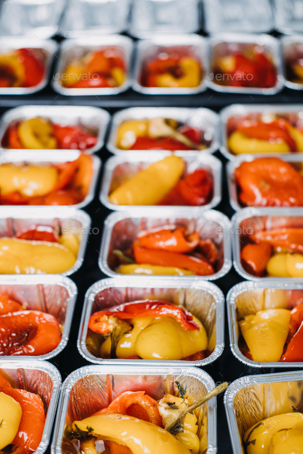 Pre-portioned Gourmet Roasted Bell Peppers in Trays. Close-up view of ...