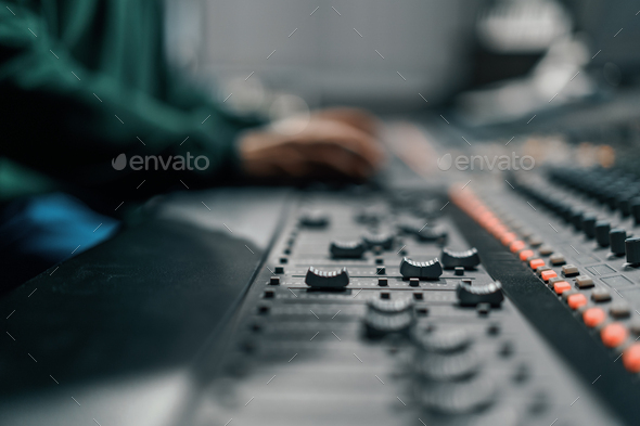 Sound engineer used digital audio mixer Sliders Engineer presses keys ...