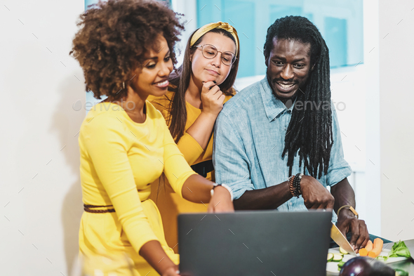 Cooking Together: Multicultural Friends Preparing a Meal in the Kitchen ...
