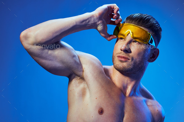 man with muscular body fashion glasses looking up Stock Photo by shotprime