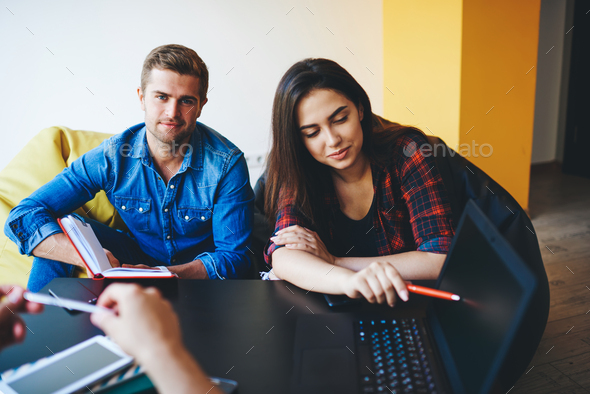 young crew of man and woman colleagues making research together Stock ...