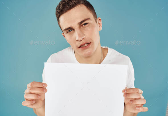 guy with flyer in hand Poster mockup blue background cropped view Stock ...