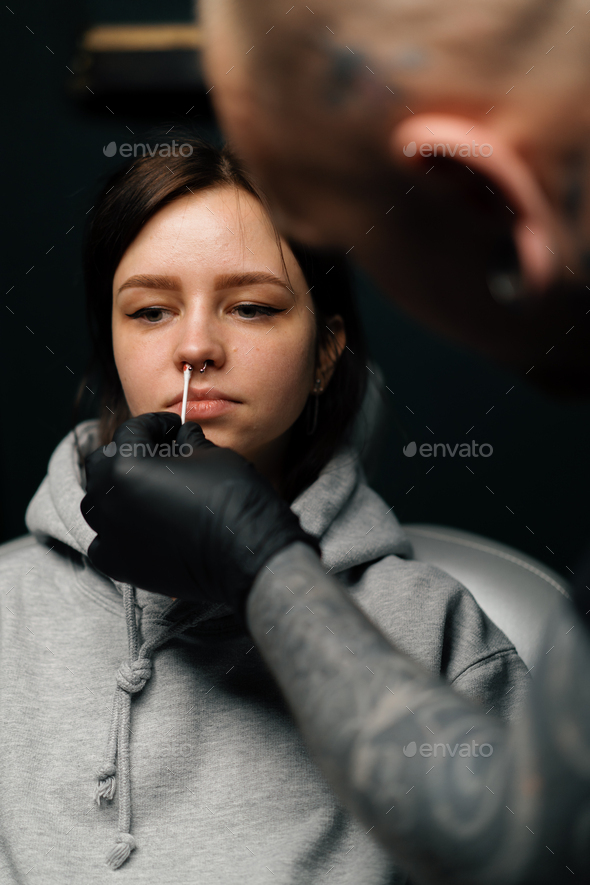 Piercing studio nose piercing for a girl after the procedure the master ...