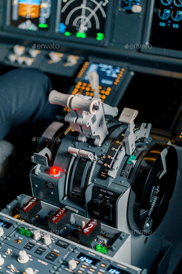 thrust lever in the cockpit of an airplane a close-up view of a flight ...