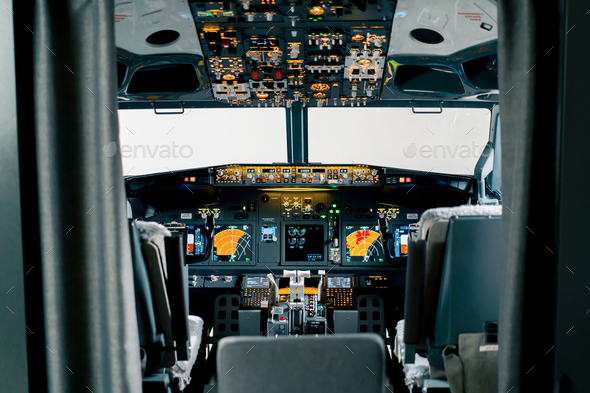 Empty airplane cockpit or flight deck modern passenger plane ready to ...