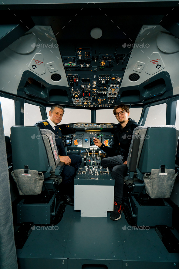 airplane cockpit pilot and young student boy smiling after training on ...