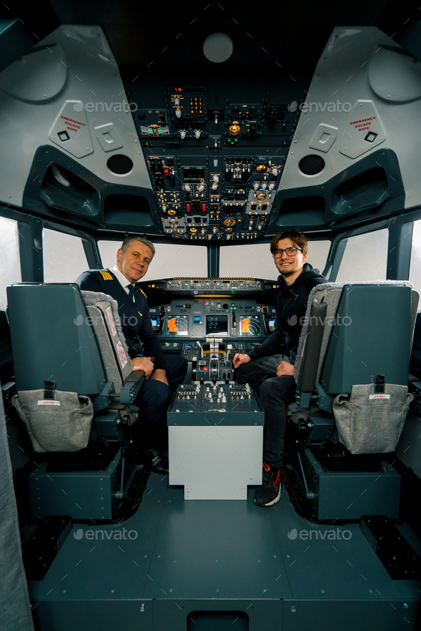 airplane cockpit pilot and young student boy smiling after training on ...