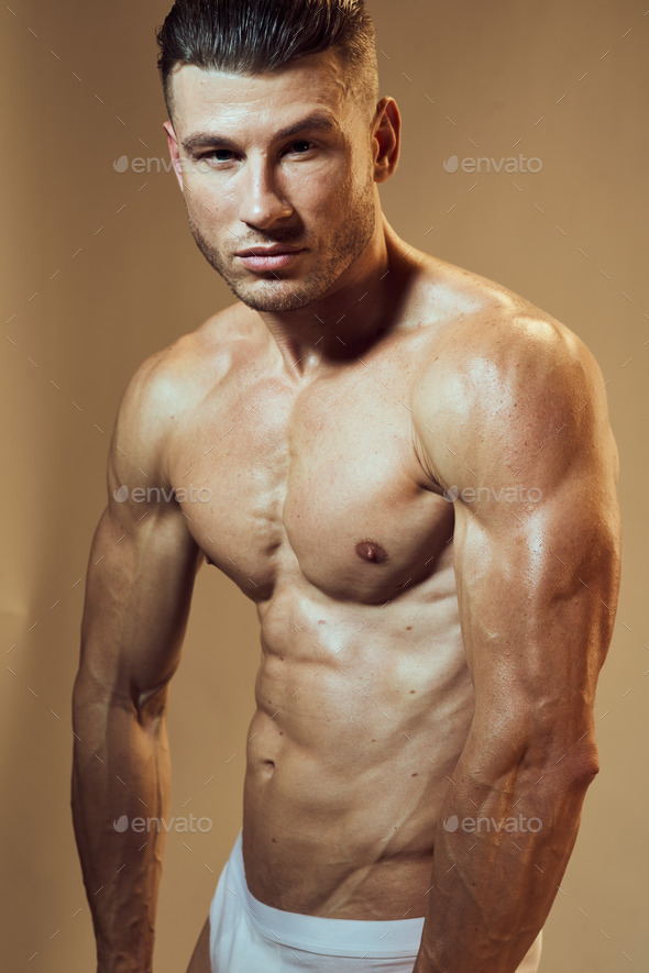 sporty man with pumped up body press posing bodybuilders workout Stock ...