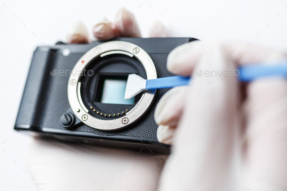 Close-up of mirrorless digital APS-C dirty camera matrix sensor cleaning Stock Photo by hiv360
