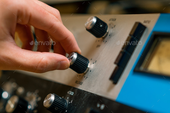 Sound engineer used digital audio mixer Sliders Engineer presses key ...